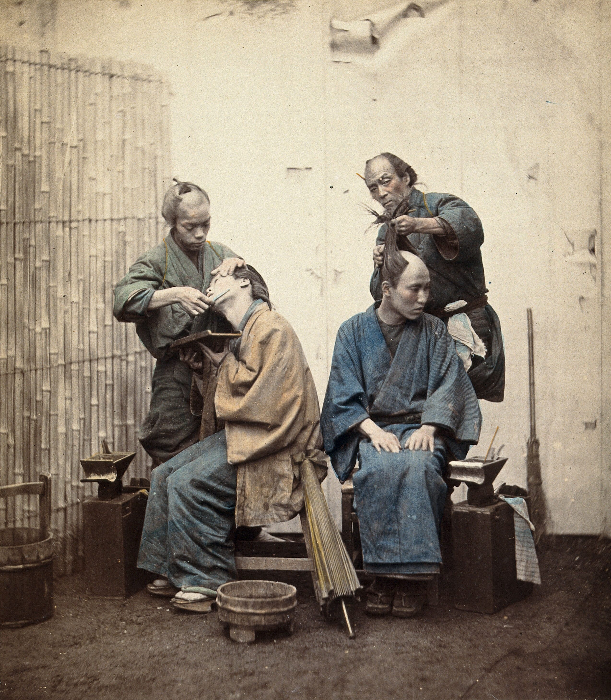 Two Japanese barbers: shaving (left), and hairdressing (right ...